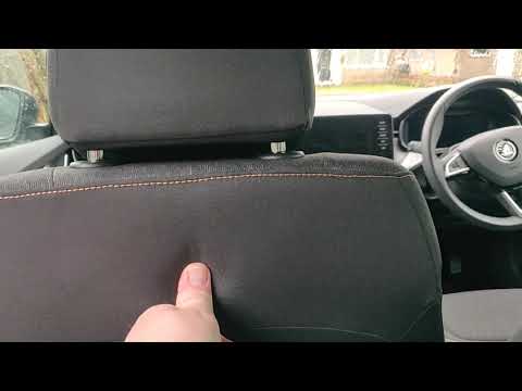 Headrest release button in Skoda Kamiq.