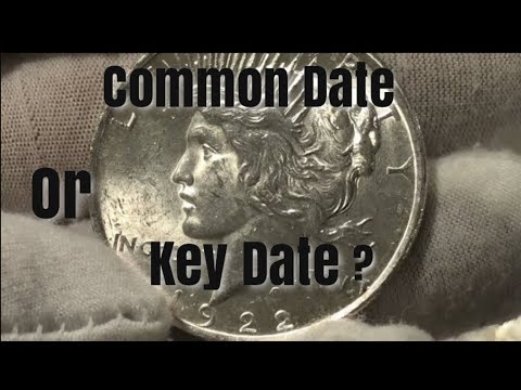Peace Silver Dollar High Grade 1922 P common date or Low Grade 1928 Key Date? | Which would you buy?
