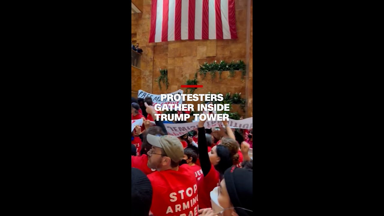 Protesters gather inside Trump Tower