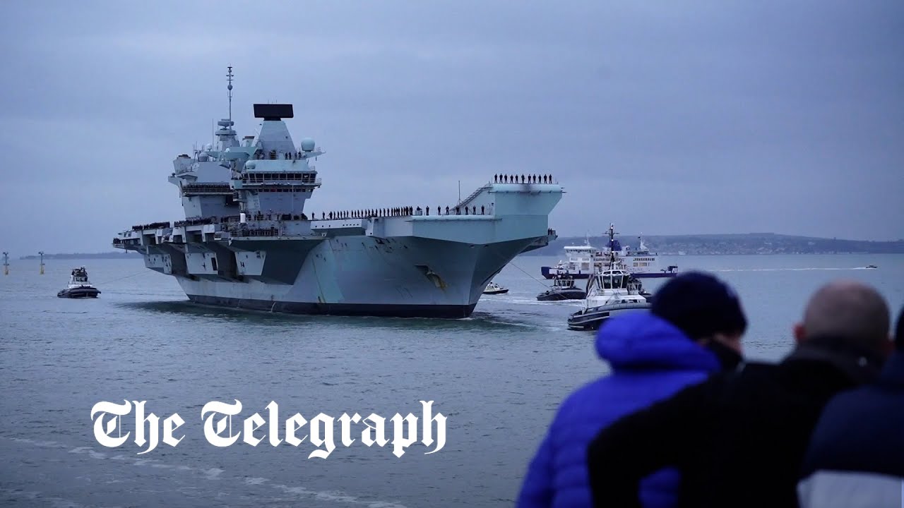 Queen welcomes home Royal Navy flagship after longest deployment since WW2
