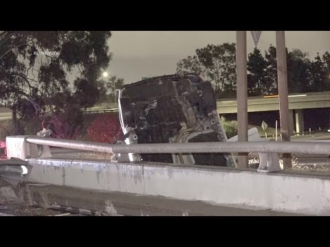 Santa Fe Springs, CA: Solo Vehicle Crash Leaves Kia Hanging Upside Down Off 605 Freeway