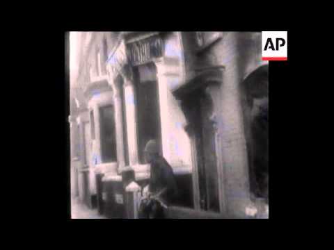 SYND 16/08/69 BRITISH TROOPS ASSESS DAMAGE AFTER DAYS OF RIOTING