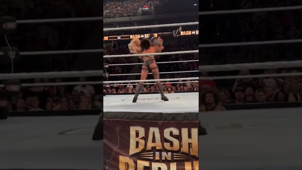Rhea Ripley's Riptide & Pretzel Pin on Liv Morgan