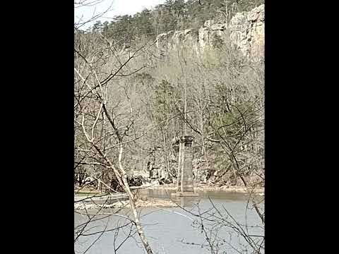 Charming rustic house and abandoned camper top on front porch and Yellow Creek Falls