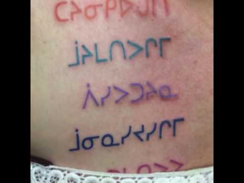 Cree writing tattoo