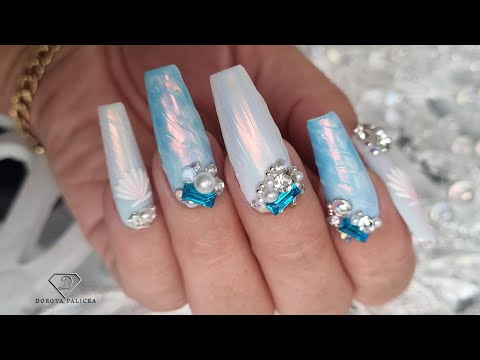 Summer chrome nails with textured 3D nail art.