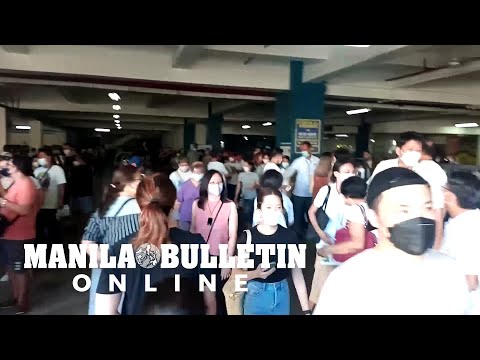 Voters continue to line up to cast their vote at Xavier School in San Juan City
