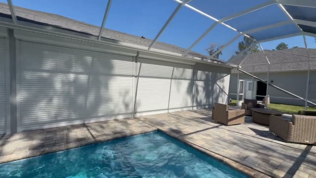 Lanai with motorized roll down shutters