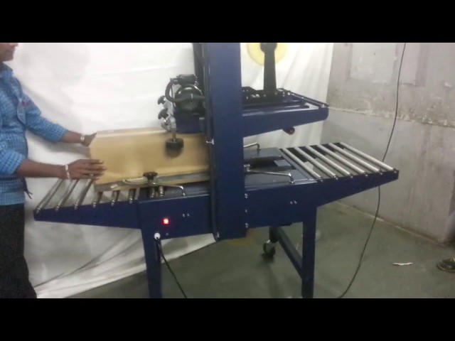Carton Tapping Machine - BOPP Tapping Machine Manufacturer from Rajkot