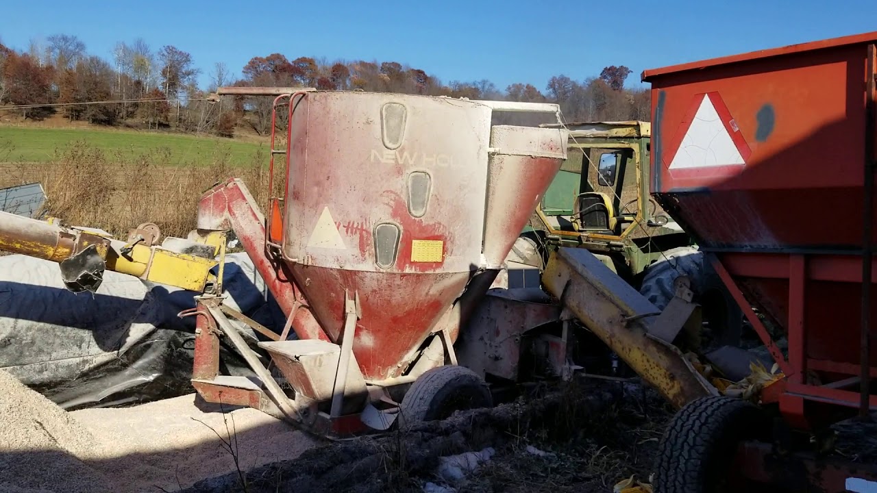 grinding cob corn making a big pile
