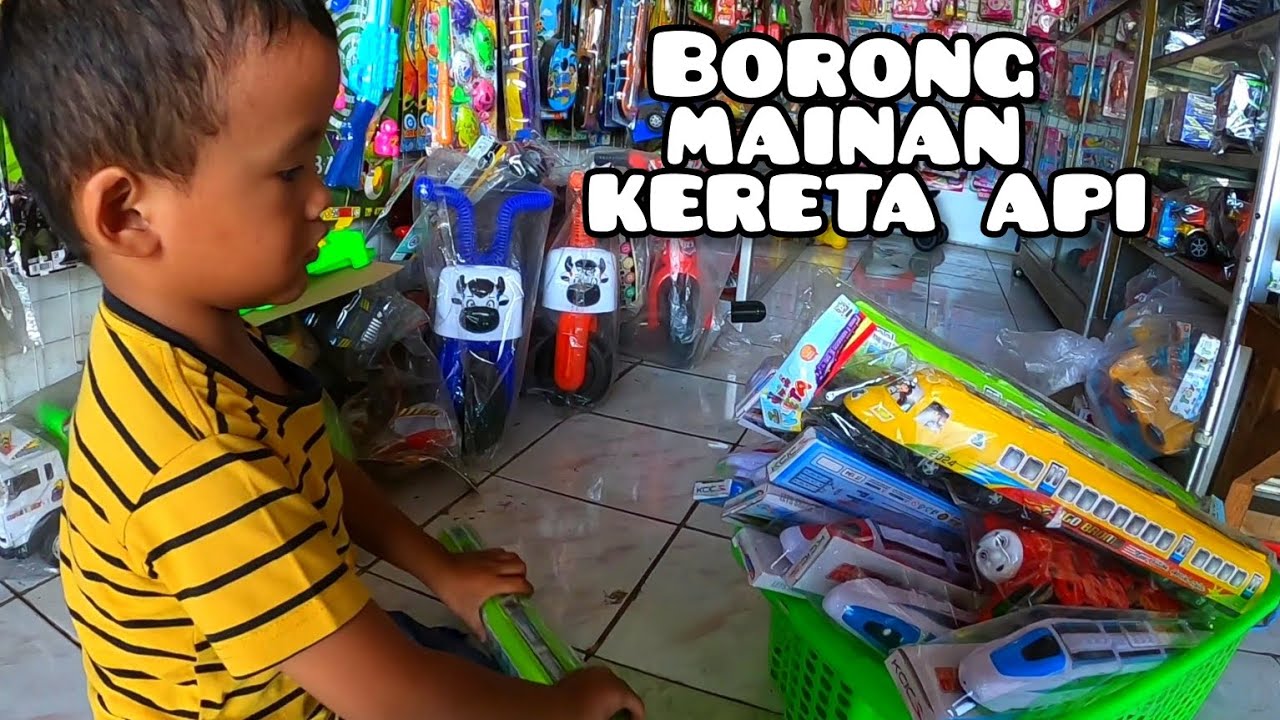 Alfatih buys train toys at the toy shop