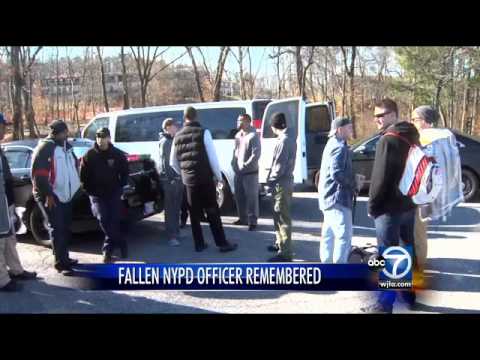 Crowds gather to mourn slain NYPD officer