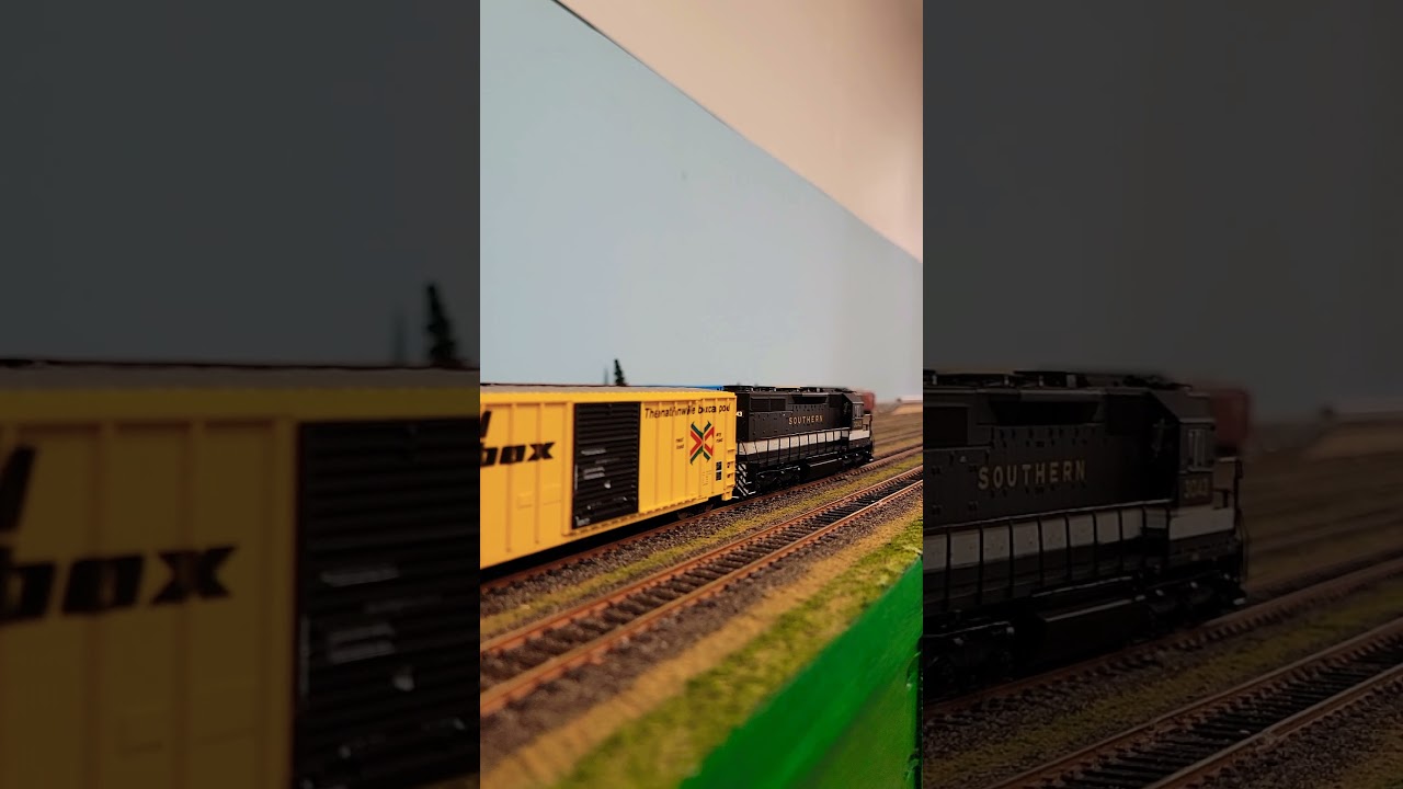 Southern SD35 #3043 shoving cars back in the yard.