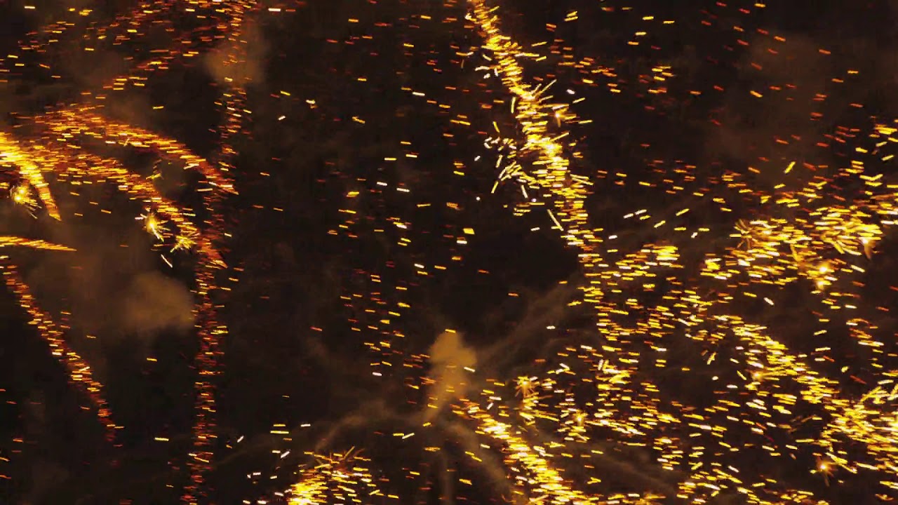 zoomed in yellow fireworks exploding