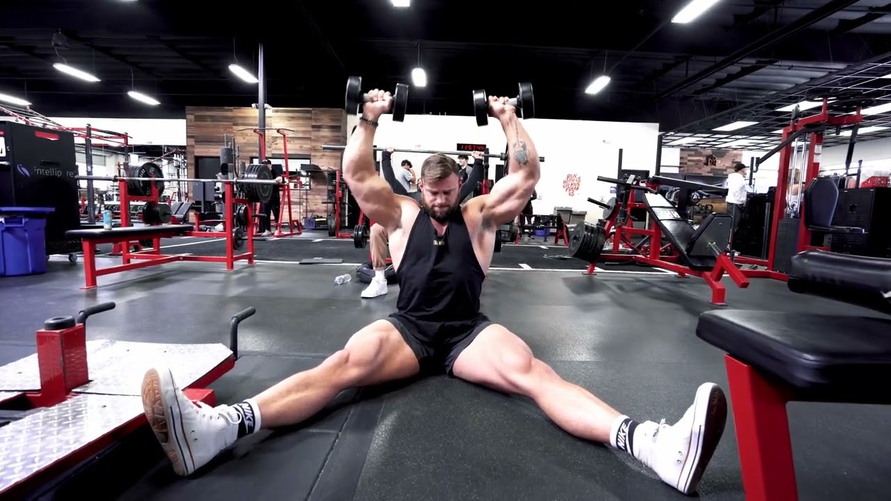 Dumbbell Straddle Shoulder Press