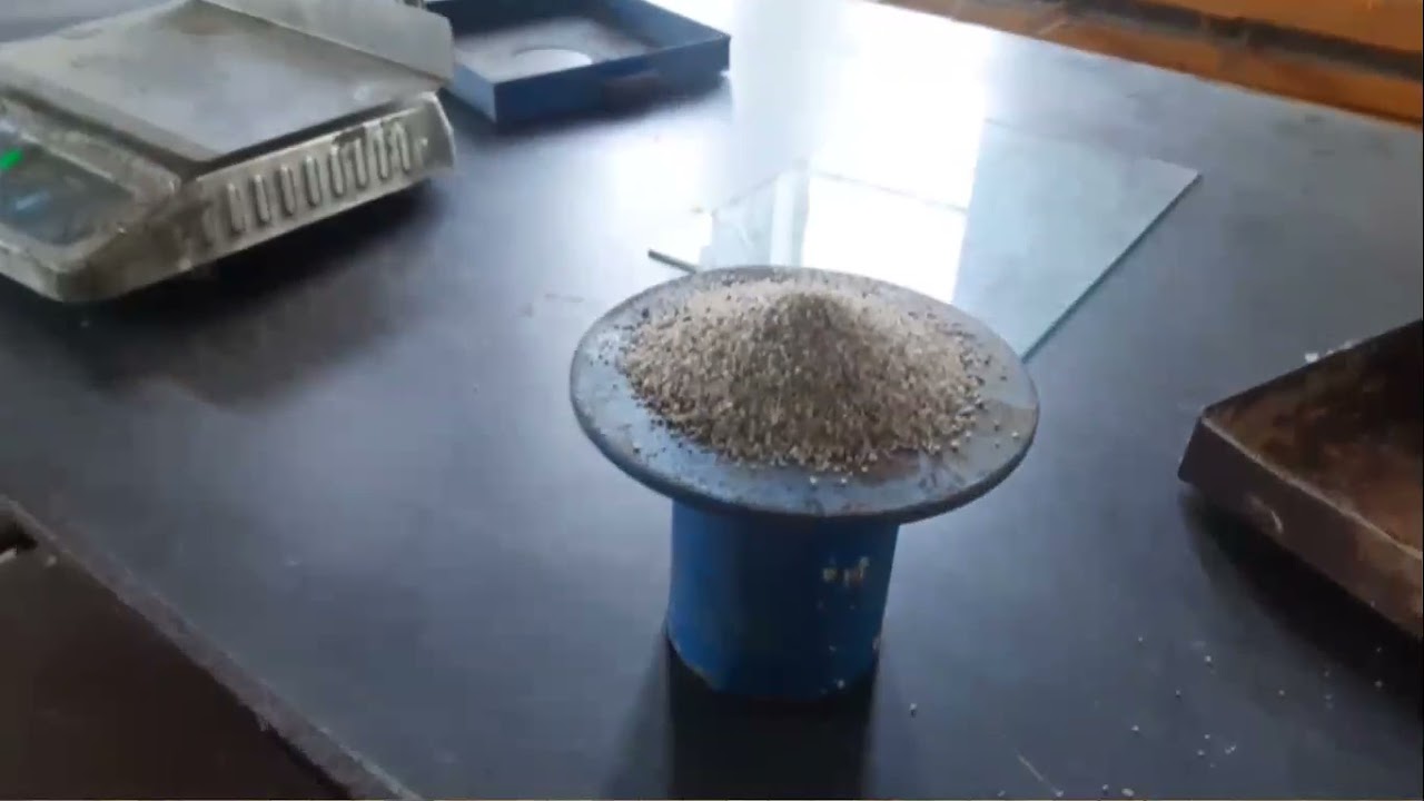 Determination of dry density by sand replacement method