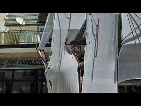 Tractor-trailer hits scaffolding, tragedy narrowly avoided