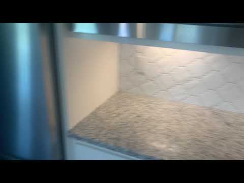 Valle Nevado Granite Countertops on White Cabinets High-End Kitchen Design