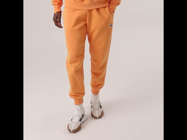 NEW BALANCE PANT JOGGER SMALL LOGO ORANJE | Courir.com