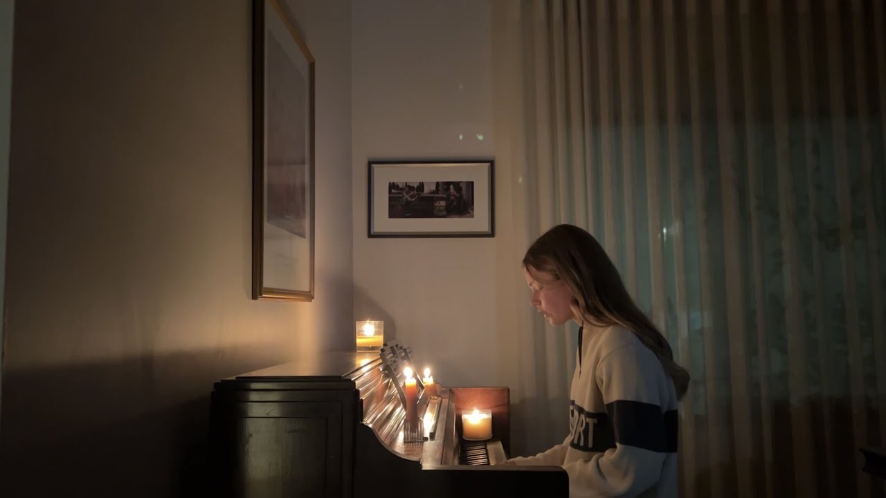 a cover of ''call your mom'' lit by candlelight