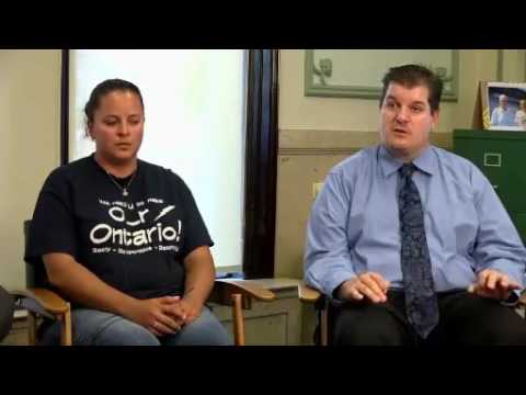 Ontario Elementary School principal Timothy Kozak and PTO president Carrie Mullins talk with managin