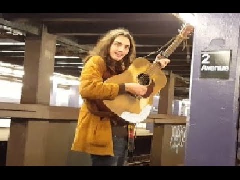 Street performer singing & playing guitar in NYC MTA subway station ...