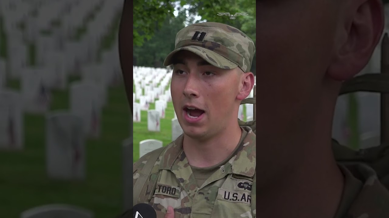 Soldiers place flags at Arlington National Cemetery to honor fallen heroes