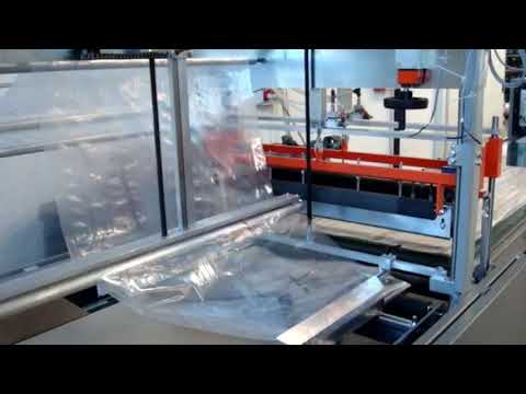 Proven way to ship doors and panels: Sotemapack's TotalPack 80 case packer by Robopac USA