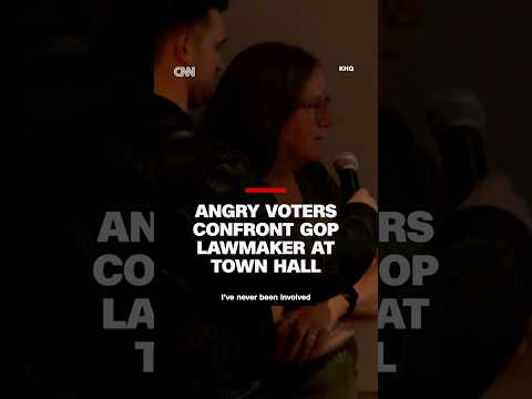 Voters confront GOP lawmaker over Trump's moves at tense town hall