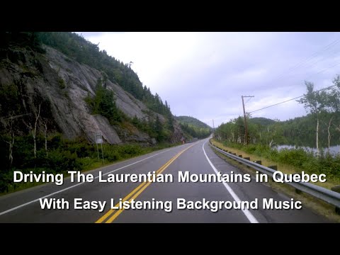 Driving in the Laurentian Mountains between Quebec City and Tadoussac with easy listening music.