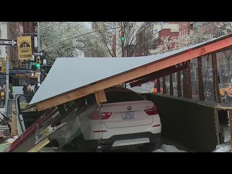 BMW SUV crashes into dining shed in Manhattan