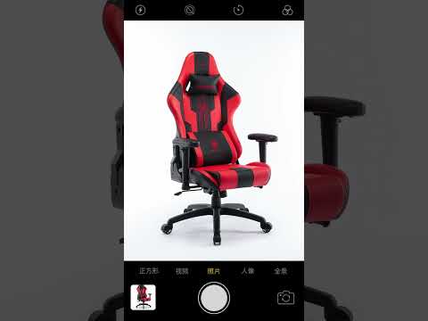 Red and black gaming chair with armrests and footrest