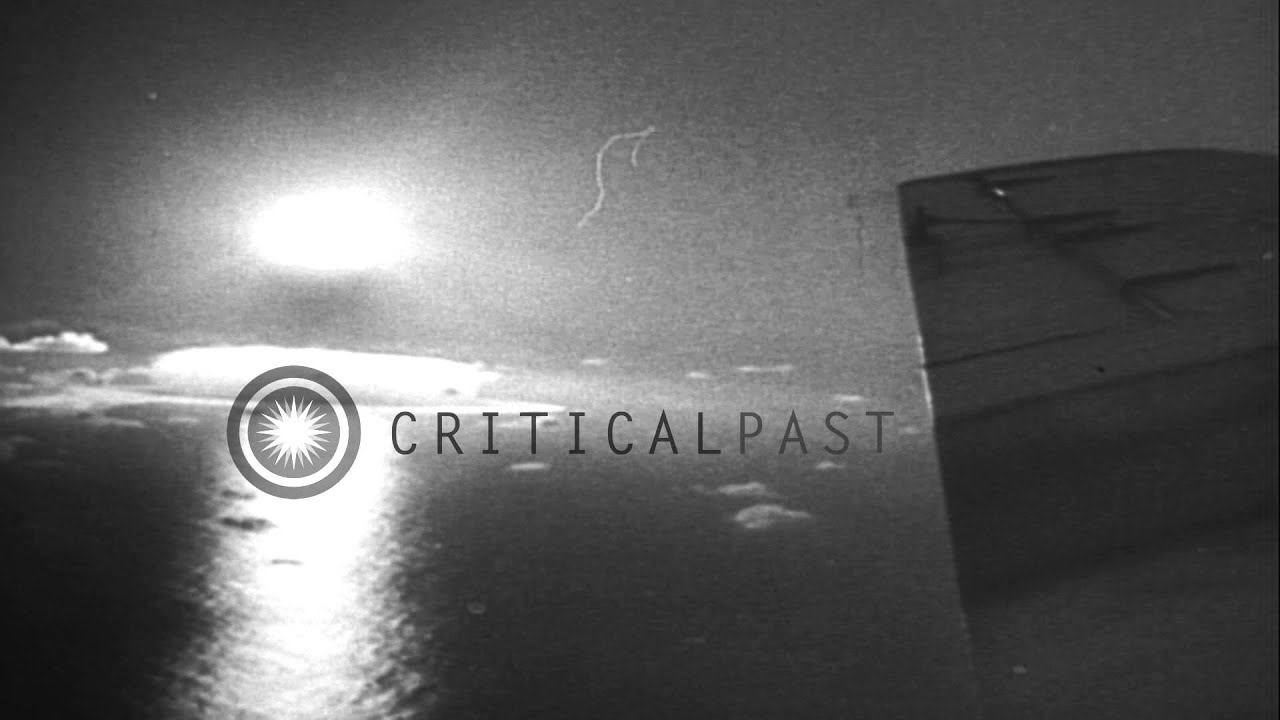 Explosion and smoke rise over Christmas Islands during first atomic bomb testing ...HD Stock Footage