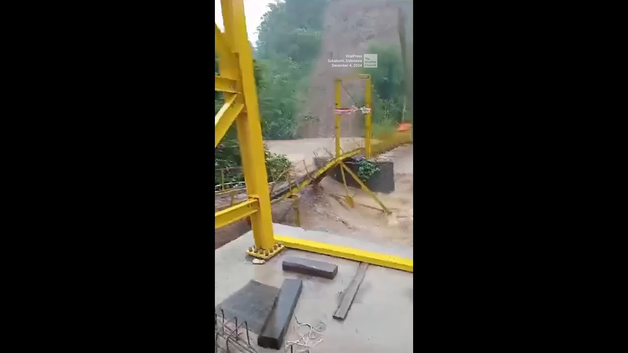 Floodwaters Rip Away Bridge In West Java