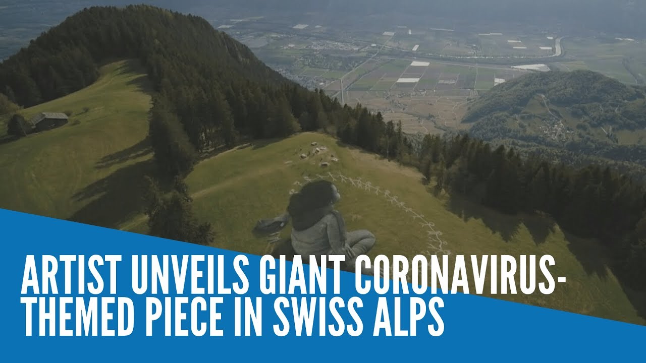 Artist Saype unveils giant coronavirus-themed piece in Swiss Alps