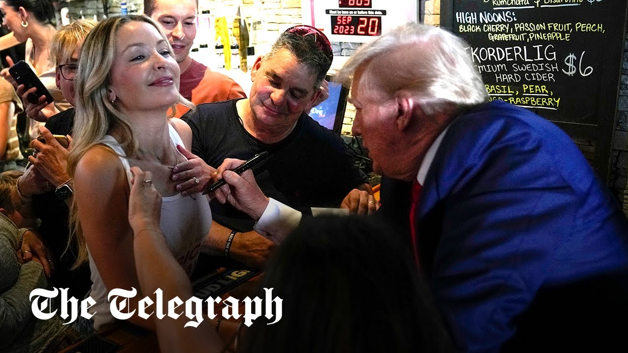 Watch: Donald Trump signs tank top of waitress and hands out pizzas on ...