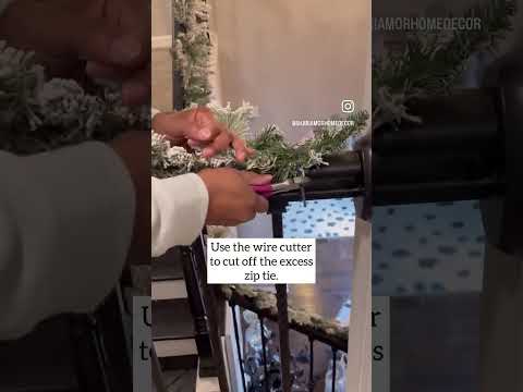 How to Add Christmas Garland to Your Stair Banister