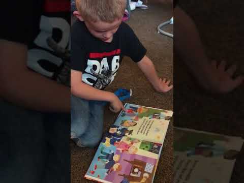 Zach reading his Super Incredible Big Brother book