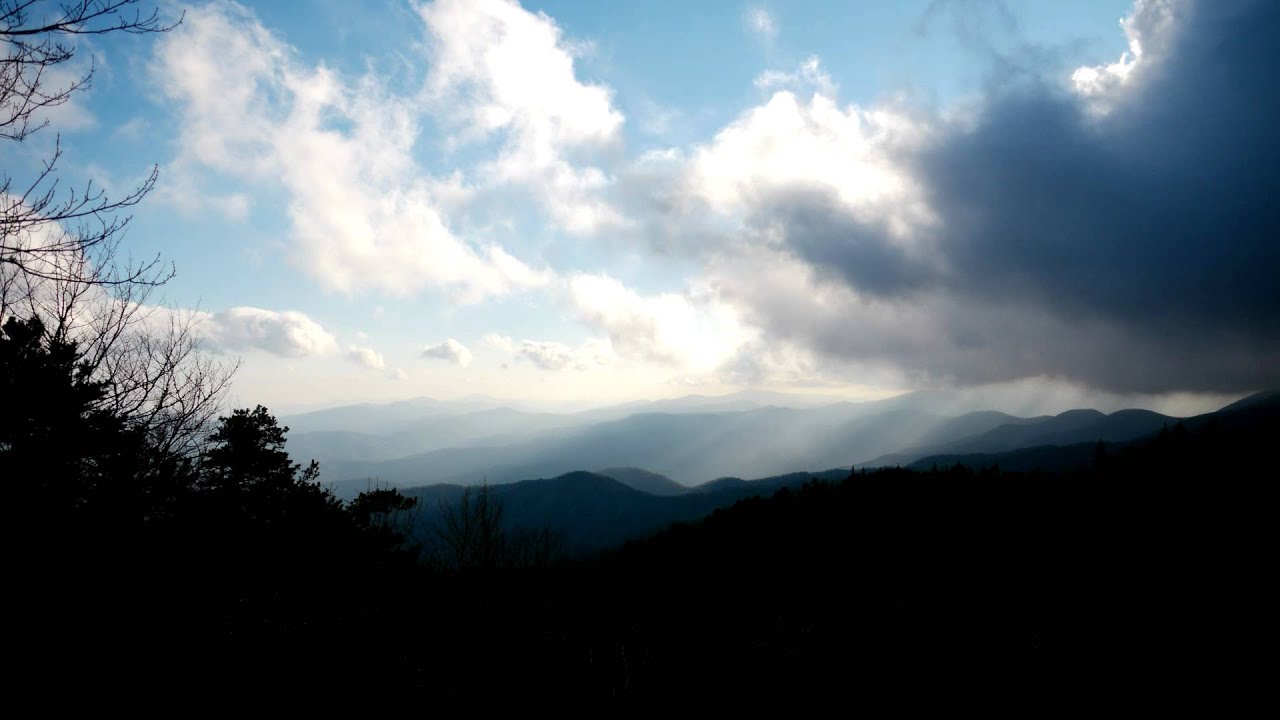 Time Lapse - Sun Rays Peeking Through Storm Clouds