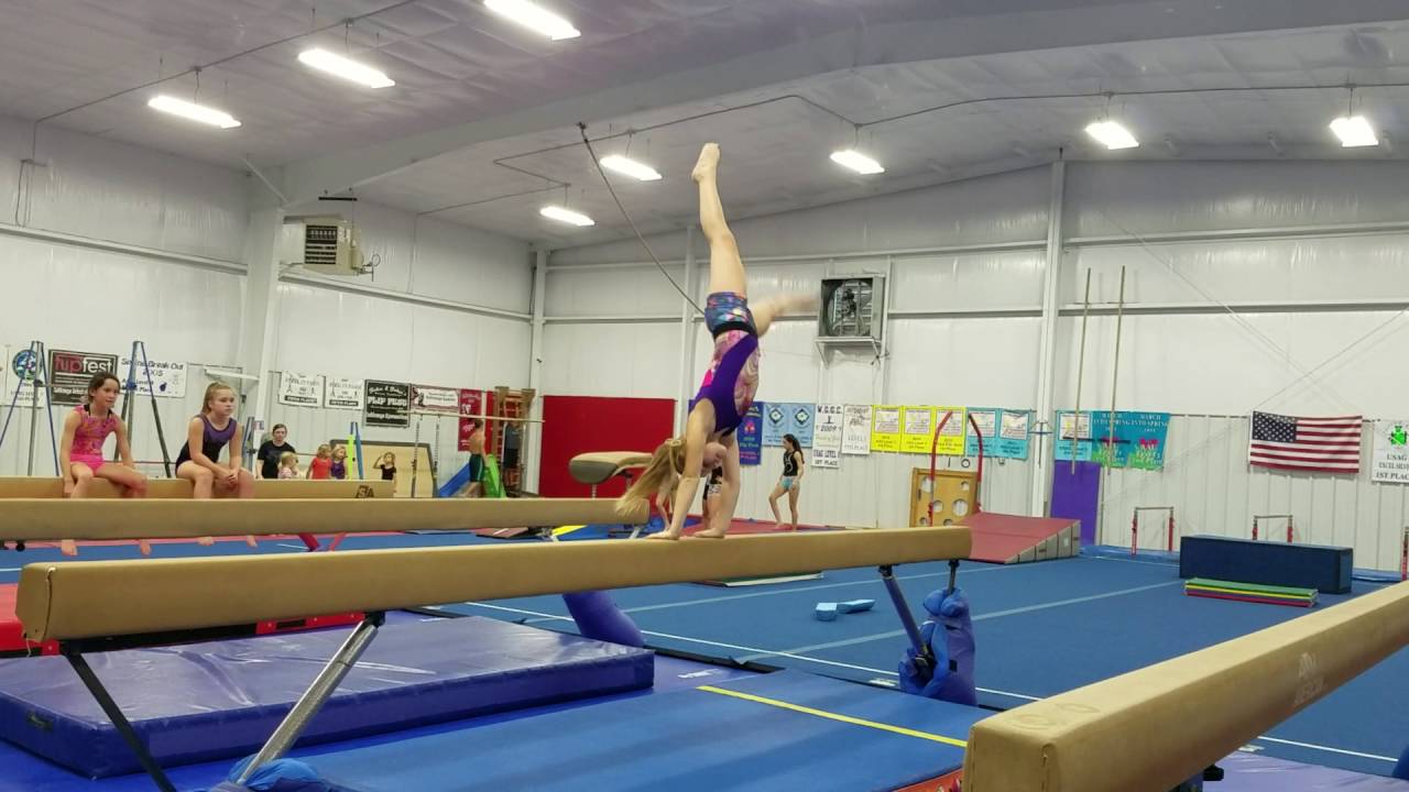 Side handstand dismount  (high beam)
