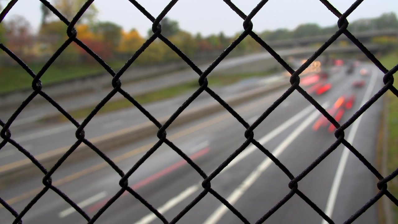 Beachfront B-Roll: Fence with Traffic Time Lapse (Free to Use HD Stock Video Footage)