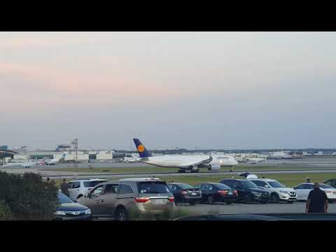 A Lufthansa 428 takeoff down the runway at Charlotte Douglas international airport.
