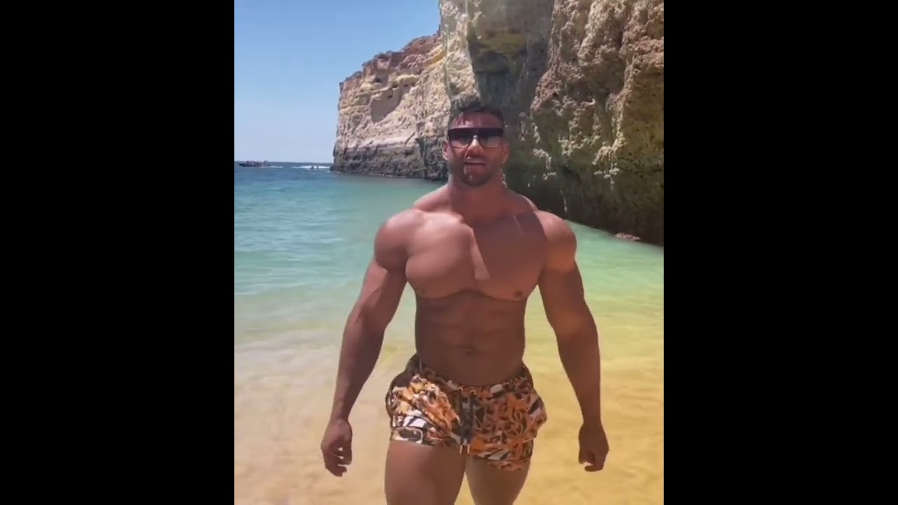 handsome guy bulging in beach
