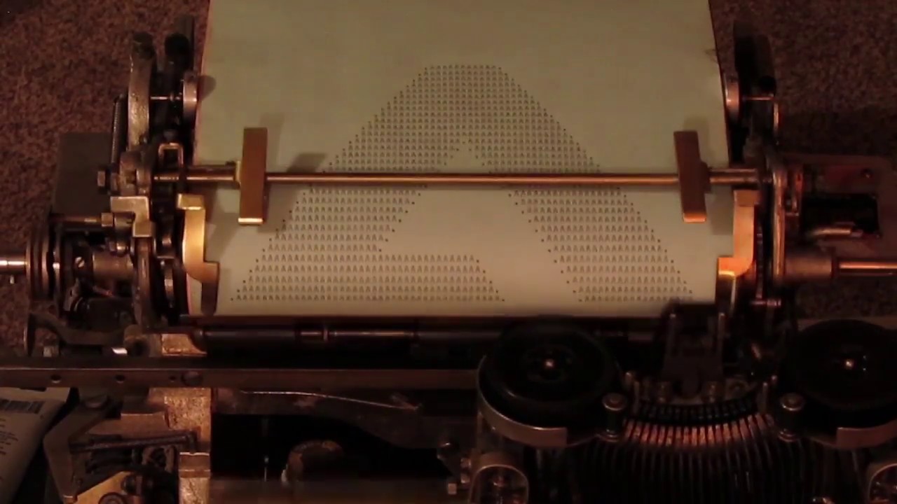 Adobe logo ASCII art printed on a 1930s teletype