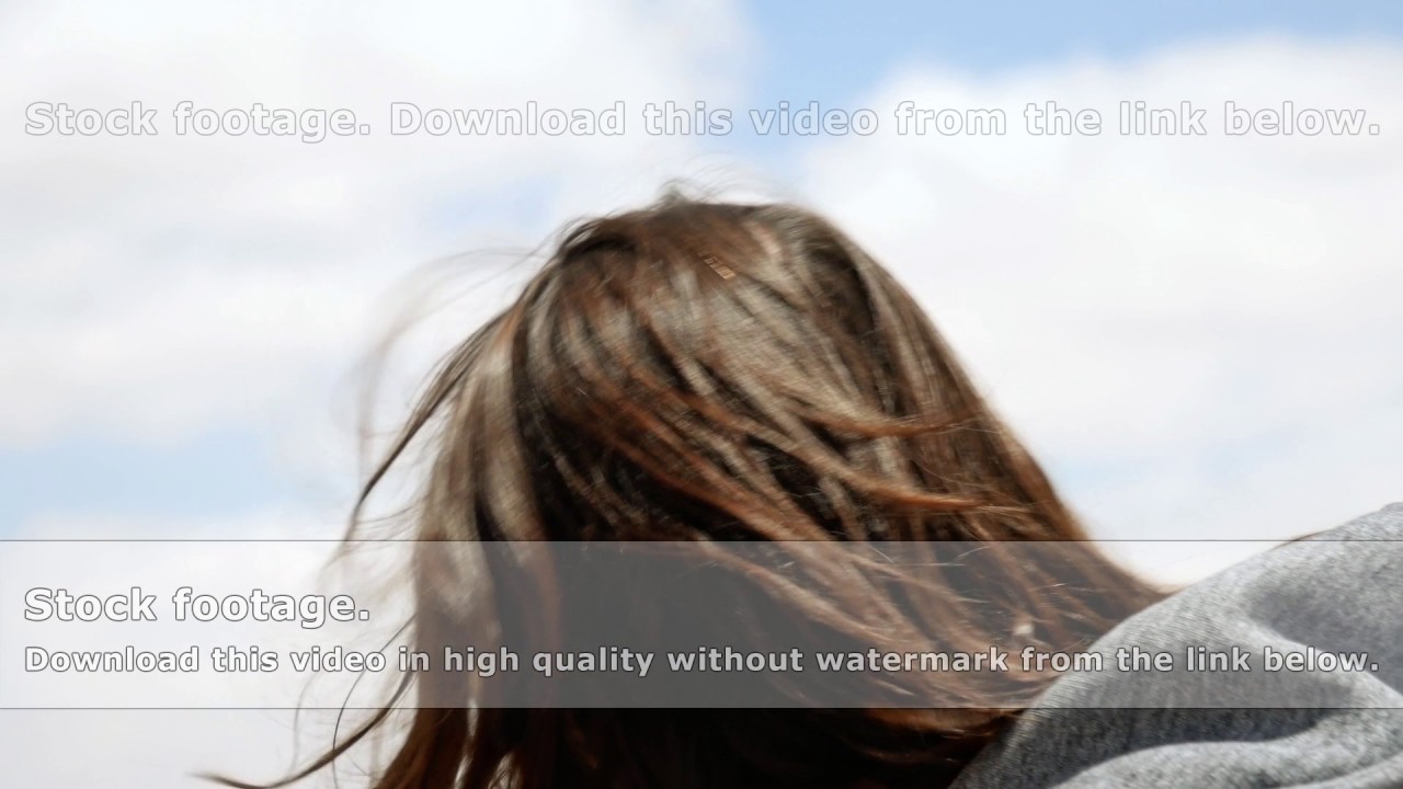 Longhair woman with flying hair outdoors