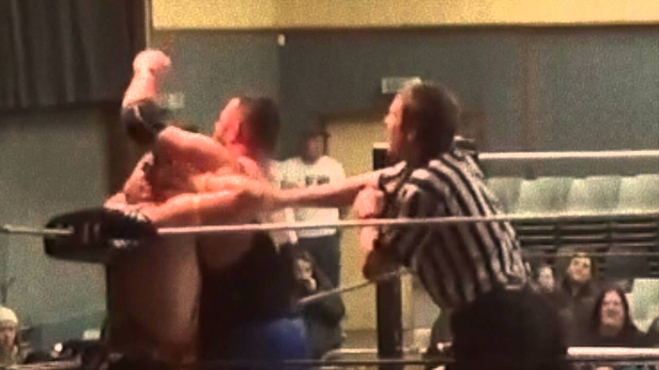 two wrestlers giving and taking pitstops