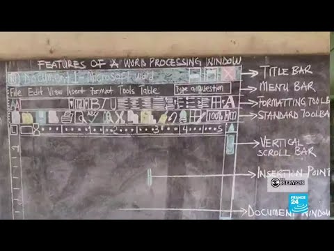 Drawing technology: teacher draws ICT lessons on blackboard for children without computers