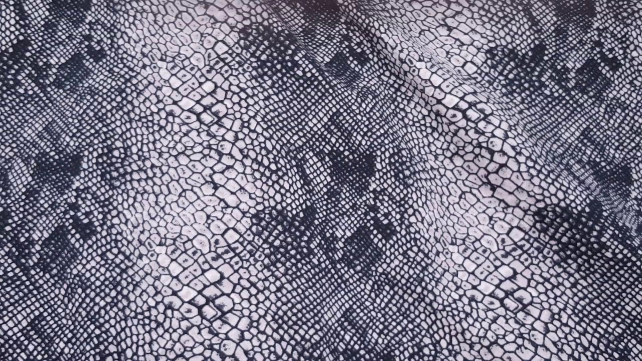 grey snake skin pattern knit fabric by Stof Fabrics