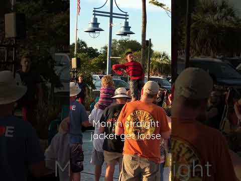 Man on beach get loose from straight jacket . 😱😱 #shorts #tiktokviral #youtubeshorts