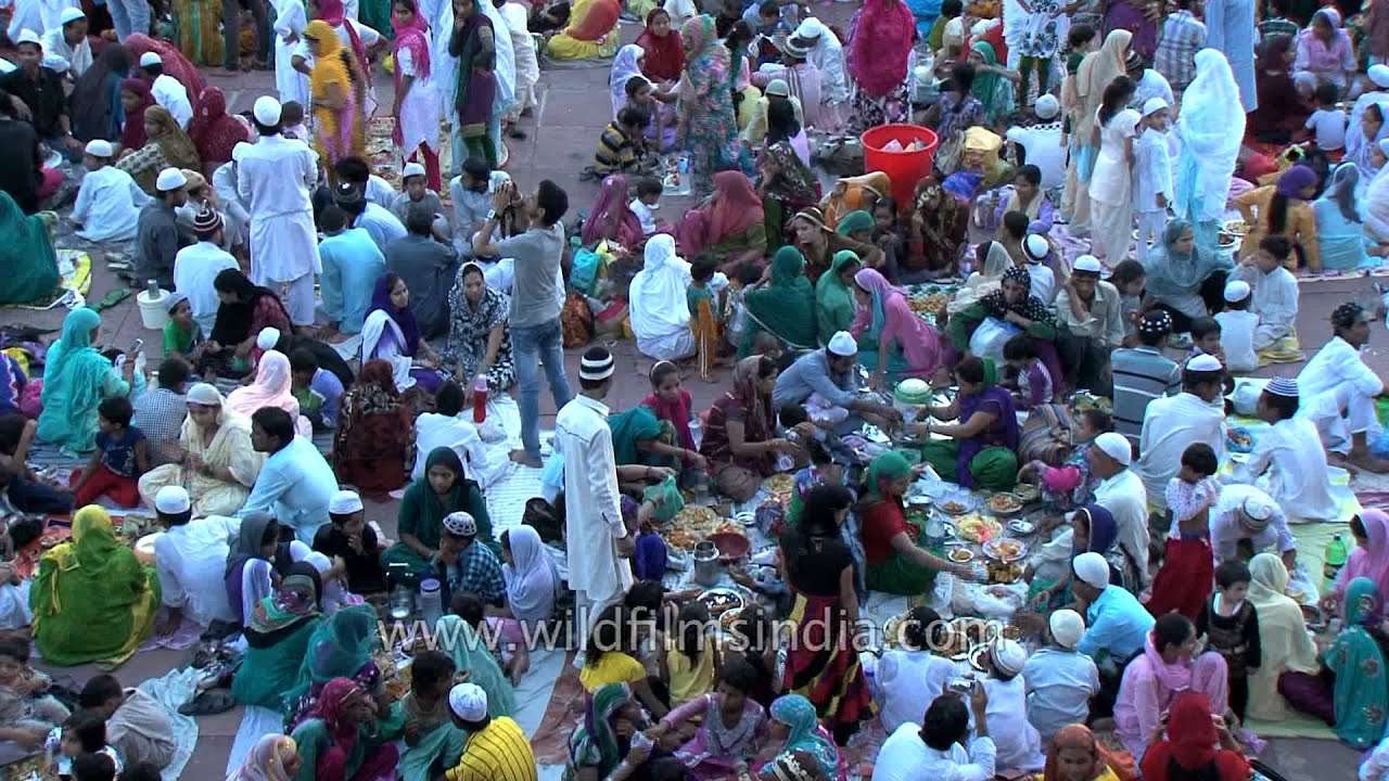 Muslim people break their day-long fast at Jama Masjid